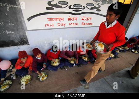 The mid-day meal scheme is a school meal program of the Government of ...
