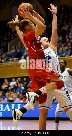 Duke's Tricia Liston shoots as North Carolina's Allisha Gray (15) falls ...