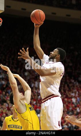 Indiana's Christian Watford (2) shoots voer Michigan's Evan Smotrycz ...