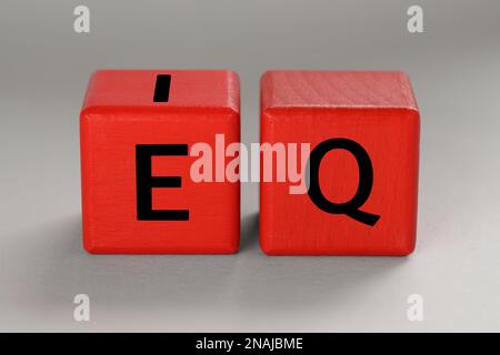 Cubes with abbreviation IQ on light blue background Stock Photo - Alamy