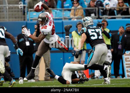NFL football player Kellen Winslow, Jr. and his wife, Janelle arrive at ...
