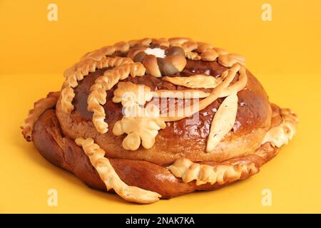 Fresh korovai on yellow background, closeup. Ukrainian bread and salt ...