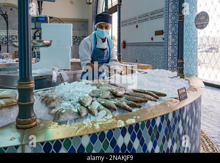 Salesman with sherry fish, Mina District Fish Market, Old Doha Port ...