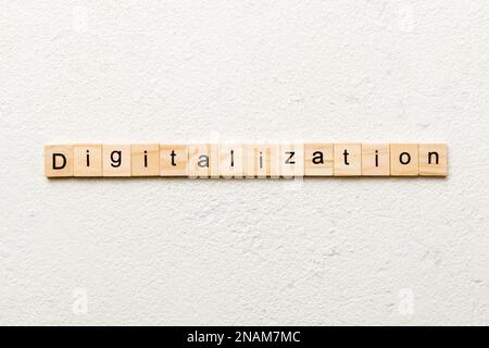 digitalization word written on wood block. digitalization text on ...