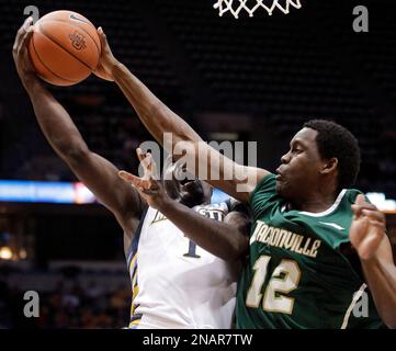 Marquette's Darius Johnson-Odom (1) is fouled by Jacksonville's Delwan ...