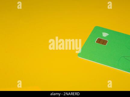 A blank card with a brown square chip symbol and a WiFi symbol. Concept ...