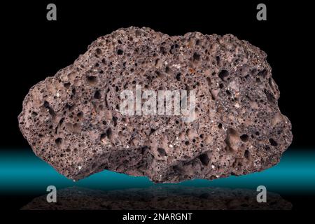 red and black porous volcanic rock called scoria, an igneous formation ...