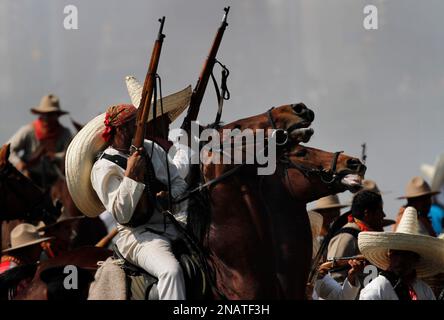 Soldiers re-enact a revolution battle as part of Mexican Revolution ...