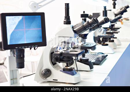 Research stereo microscopes with computers monitor Stock Photo - Alamy