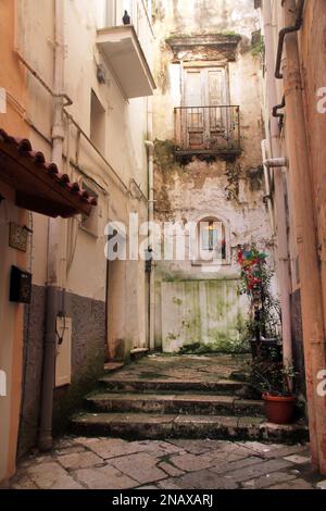 Gaeta, Italy. Narrow unkempt alleyway between residential buildings in ...