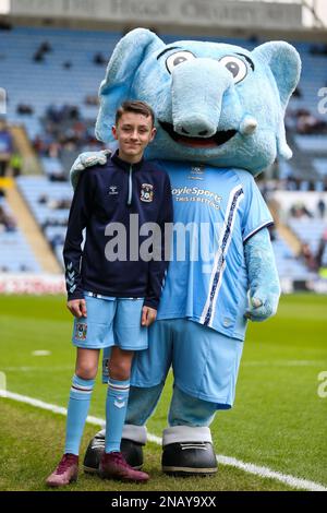 A Coventry City matchday mascot poses for a photo with Sky Blue Sam ...