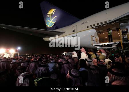 Relatives from the Saudi royal family pray during the funeral of the ...