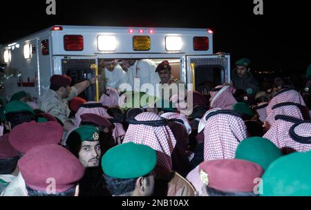 Relatives from the Saudi royal family pray during the funeral of the ...