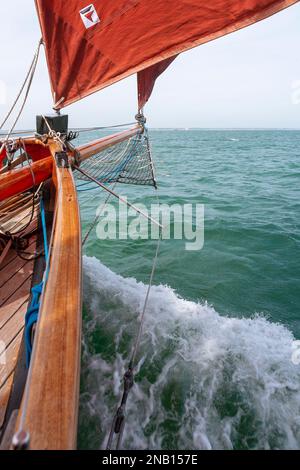On board the traditional gaff cutter "Jolie Brise" as she reaches ...