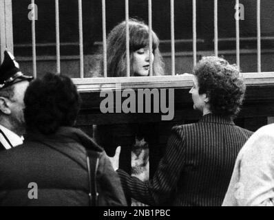 Carol Compton, a 21 - year - old Scottish nanny, is seen behind the ...