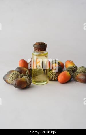 Acorn essential oil isolated on white background Stock Photo - Alamy
