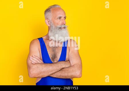 Photo of focused aged person crossed hands look concentrated camera ...