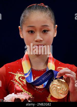 Gold medalist Sui Lu of China, left, greets a Russia's gymnast after ...