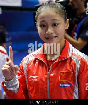 Gold medalist Sui Lu of China, left, greets a Russia's gymnast after ...