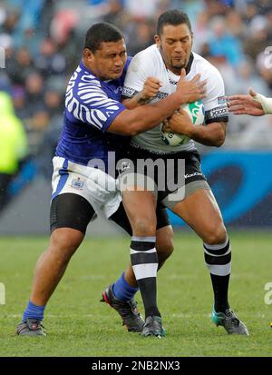 Fijian rugby player Nicky Little warms up during training at Eden Park ...