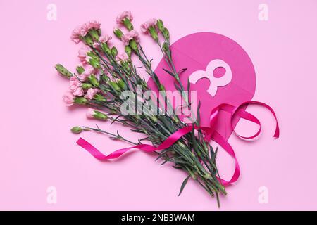 Paper female figure and beautiful carnation flower on color background ...