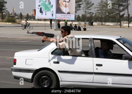 A member of Iranian police special forces, acting as a robber, performs ...
