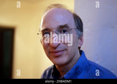 Nobel Prizes winner for physics Saul Perlmutter smiles as he poses with ...