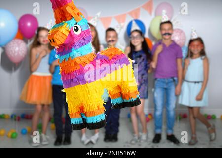 Bright festive pinata hanging indoors at birthday party Stock Photo - Alamy