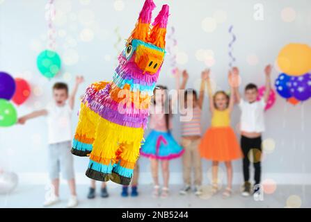 Bright festive pinata hanging indoors at birthday party Stock Photo - Alamy