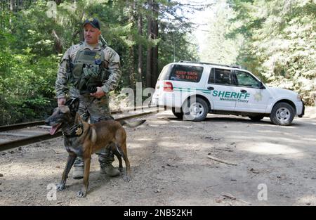 Mendocino County sheriff's deputy Joey DeMarco, left, with his patrol ...