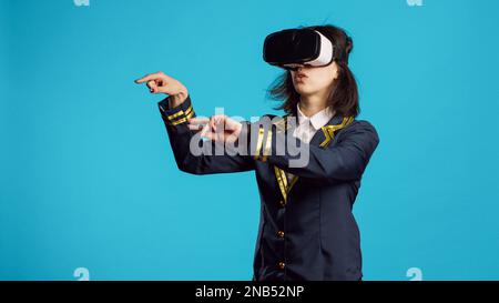 Professional aviator using vr glasses to land airplane, having fun with ...