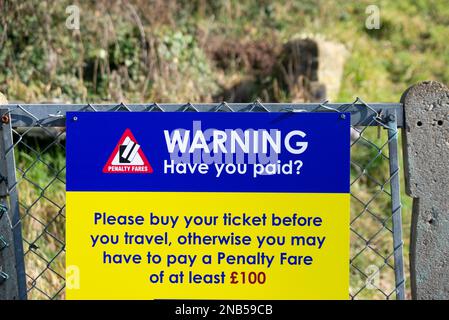 Penalty fare railway warning notice Stock Photo - Alamy