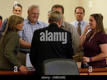 Steve Downing, left, an attorney for Chuck Cox (not shown) the father ...