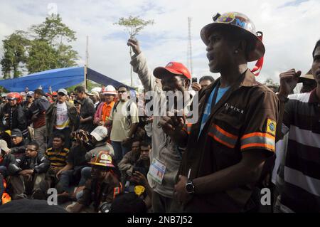 Workers of Freeport-McMoran's gold and copper mine shout slogans during ...
