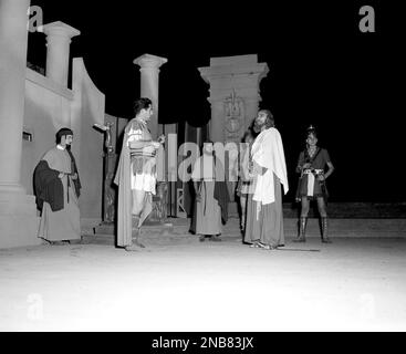 Pilate washes his hands; Passion of Christ. Pontius Pilatus is sitting ...