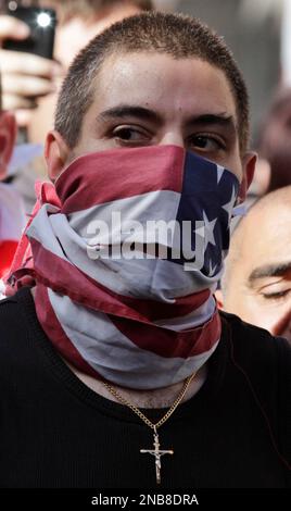 A EDL ( English Defense League) member seen with a flag. Credit David ...