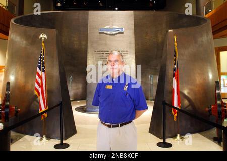 Retired Col. John M. House stands near the memorial to retired Col ...