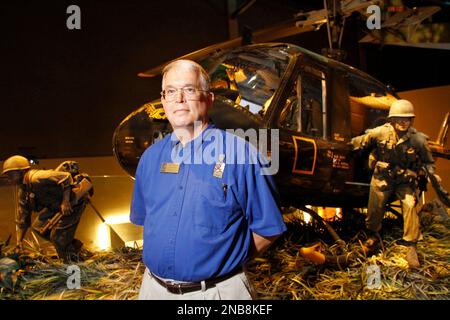 Retired Col. John M. House stands near the memorial to retired Col ...