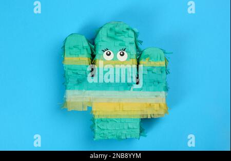 Bright cactus pinata on light blue background, top view Stock Photo - Alamy