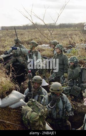 A soldier of the 7th Light Infantry Division carries an M-16A2 rifle ...
