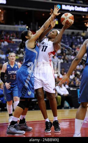 Washington Mystics' DeMya Walker (11) and Nicky Anosike (21) battles ...