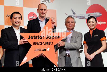 Japan Airlines Corp. President and CEO Haruka Nishimatsu, center, holds ...