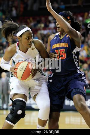 Seattle Storm's Camille Little, left, drives past the Phoenix Mercury's ...