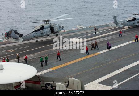 230212-N-WM182-1230 SOUTH CHINA SEA (Feb. 12, 2023) An MH-60R Sea Hawk ...