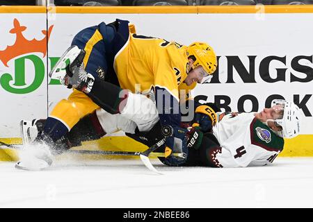 Nashville Predators left wing Cole Smith, left, checks Arizona Coyotes ...