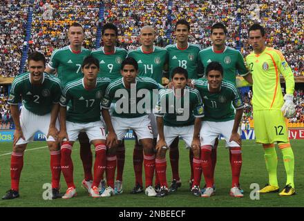 Mexico's U-20 soccer players pose for photos with their trophy after ...