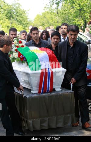 During the funeral of one of the victims of the rampage shooting ...