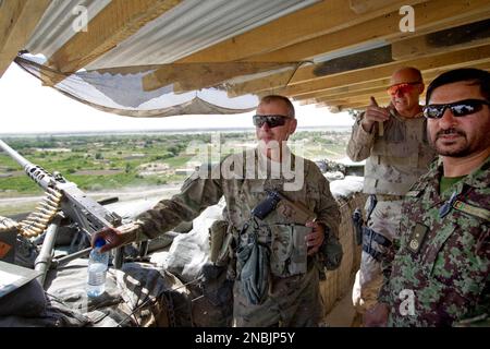 Afghan soldiers give a hand up to a fellow soldier after a training ...