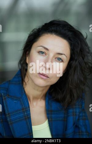 Photo of the Attractive business woman use smart phone and sitting at ...