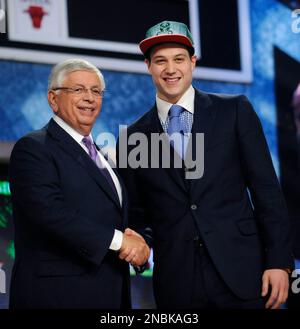 Milwaukee Bucks No. 1 draft pick Andrew Bogut, left, tries to stop New ...